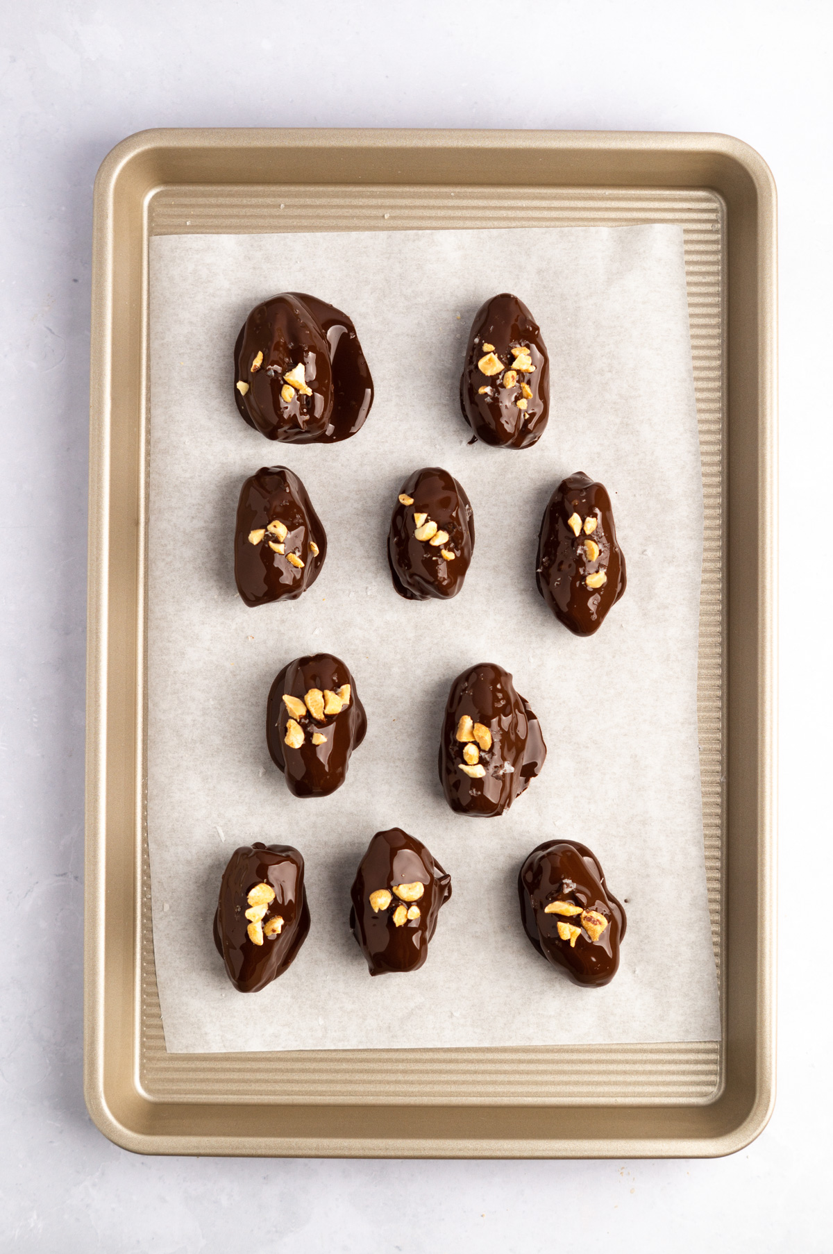 Easy Chocolate Covered Date Snickers | Begin With Balance